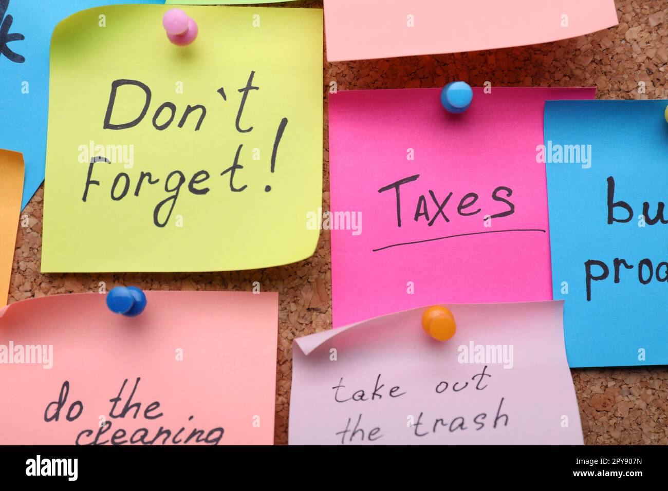 Different paper notes on cork board, closeup Stock Photo - Alamy