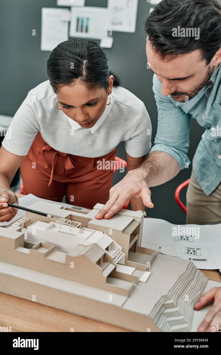 Planning each section of their construction. two architects working ...