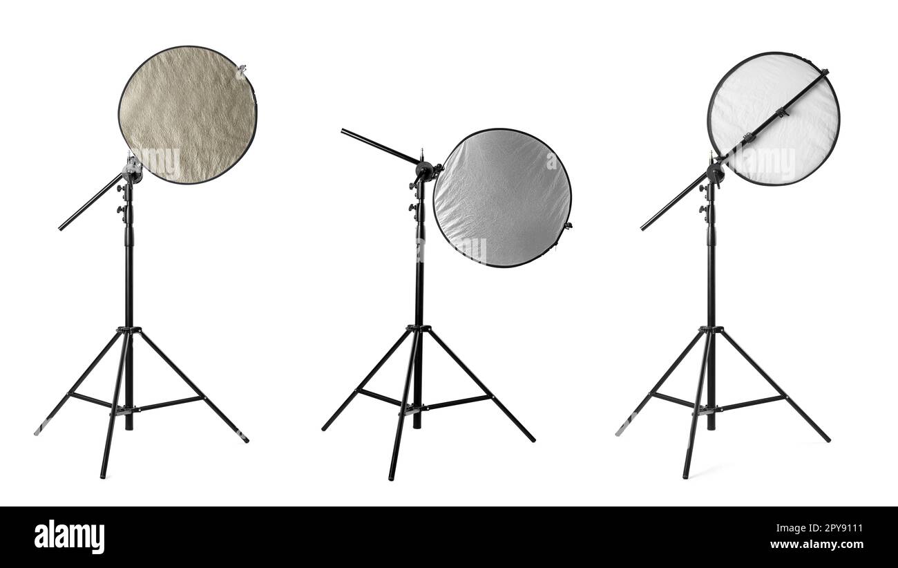 Set of tripods with different reflectors on white background ...