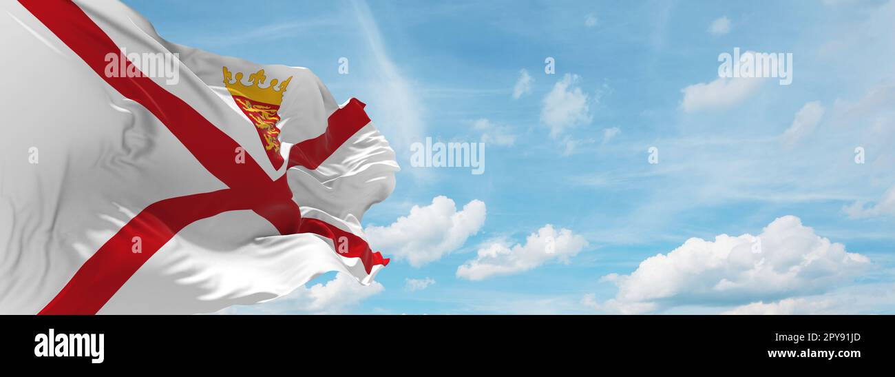 flag of Gallo-Romance peoples Jerriais people at cloudy sky background ...