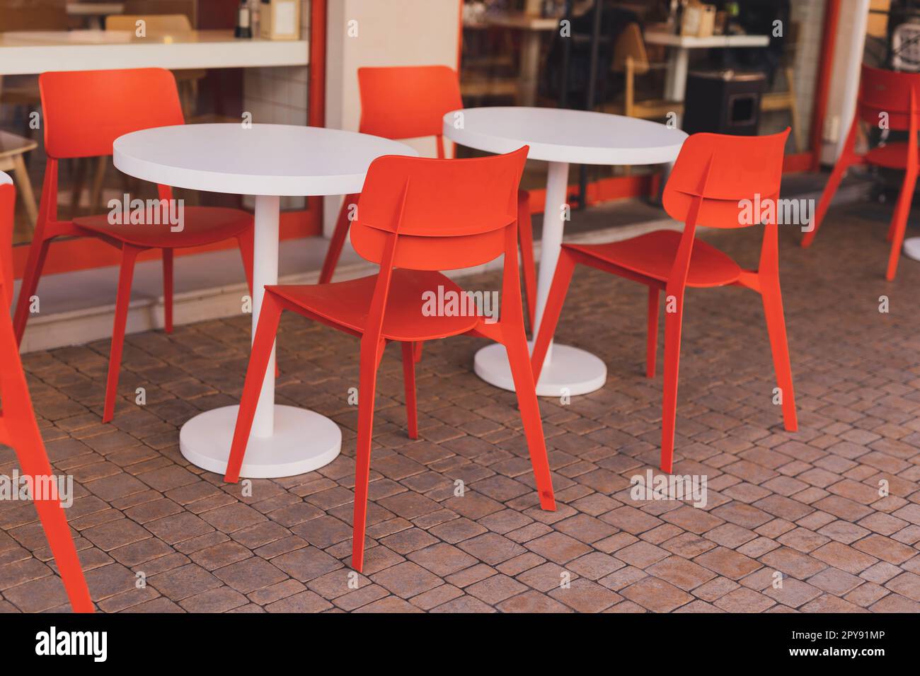 Empty cafe terrace with tables and chairs. Exterior of cafe restaurant ...