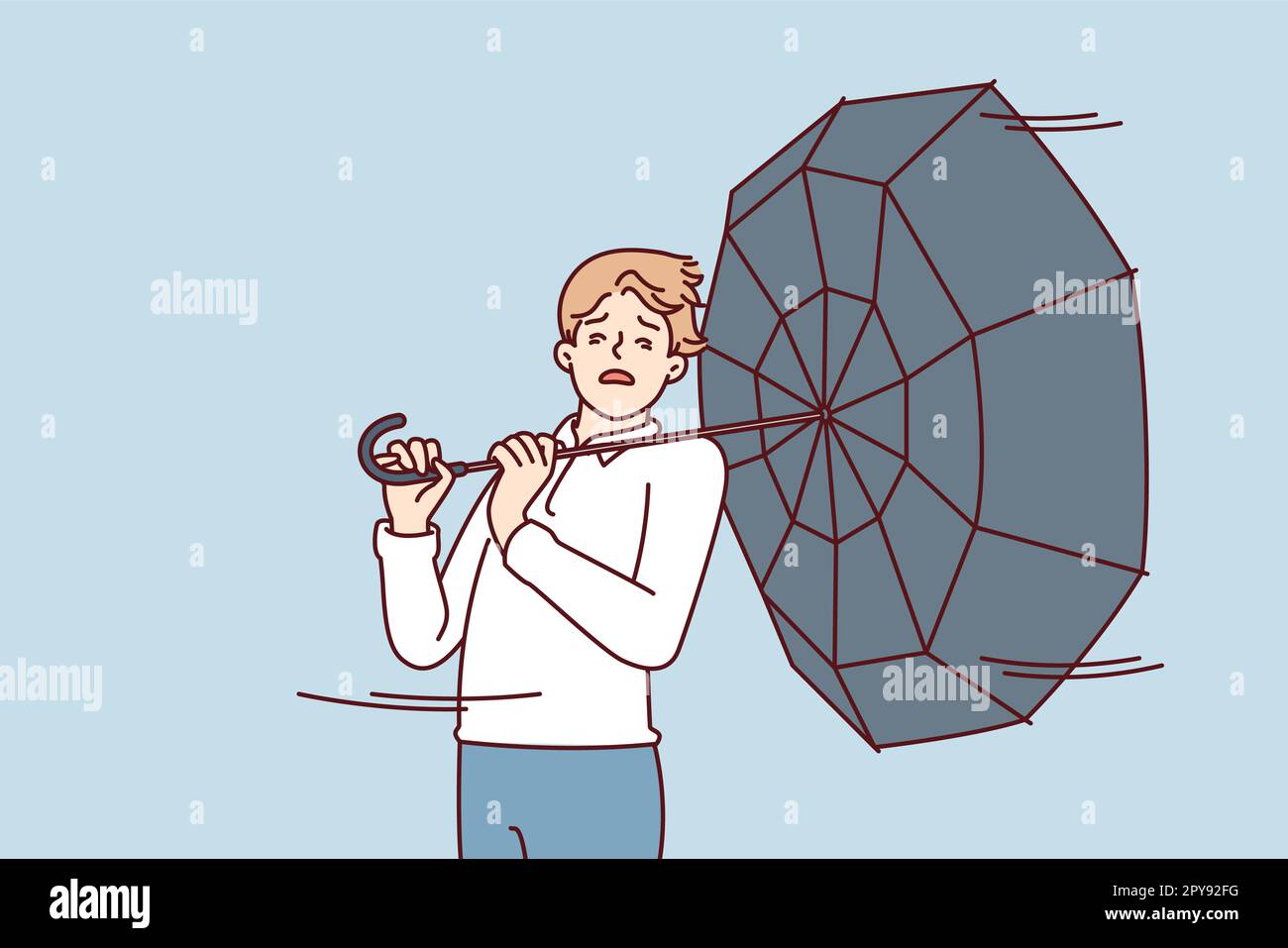 Man with umbrella turned backwards walks down street during severe life ...