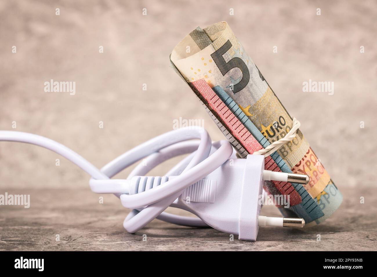 White electric plug and roll of euro currency Stock Photo - Alamy