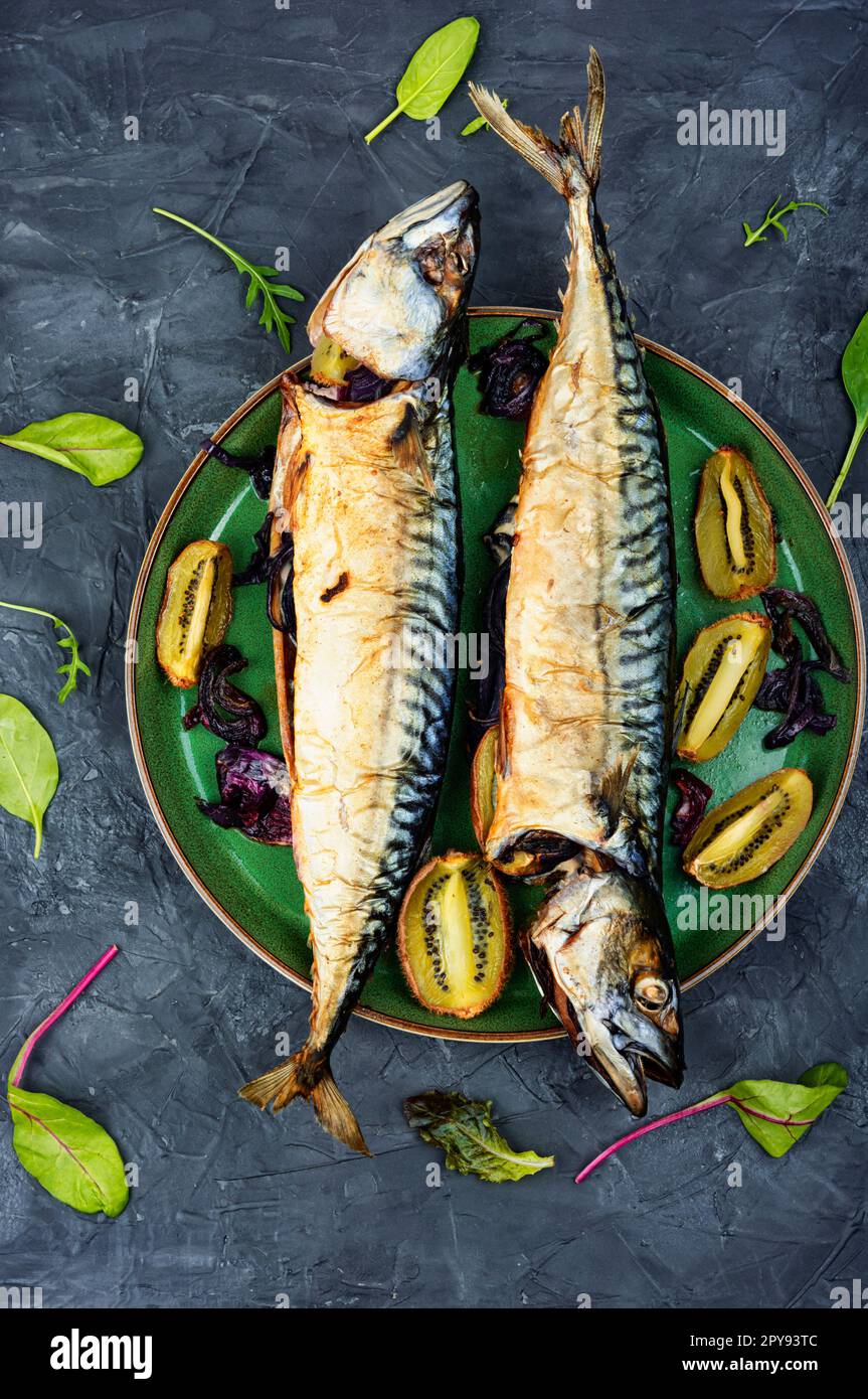 Grilled mackerel fish with kiwi Stock Photo - Alamy