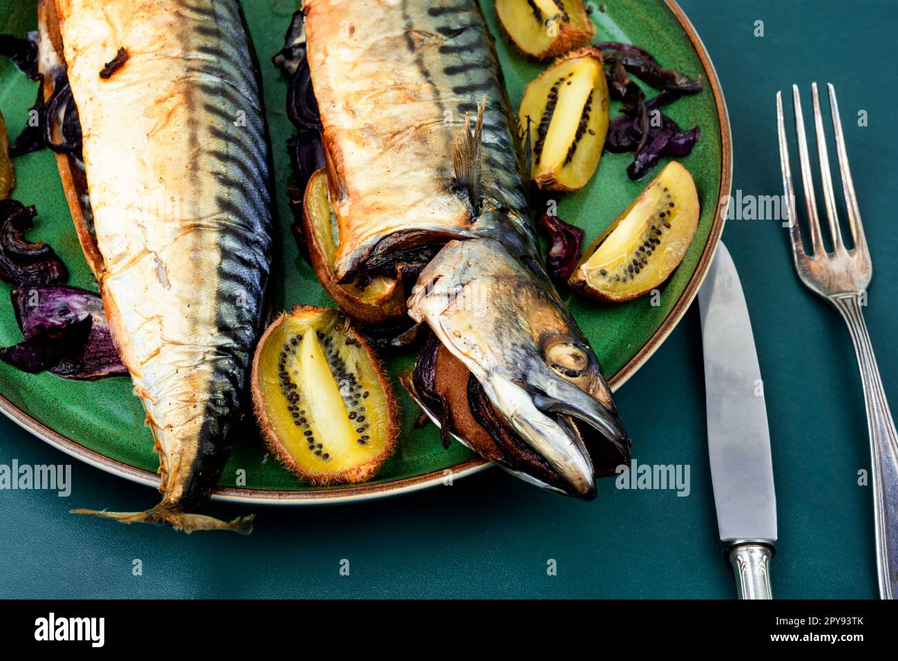Grilled mackerel fish with kiwi Stock Photo - Alamy