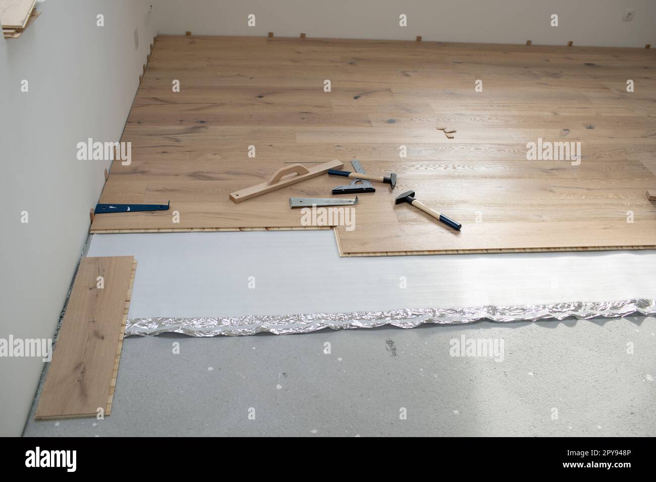 parquet floor laying in a new room, loft, new house Stock Photo - Alamy