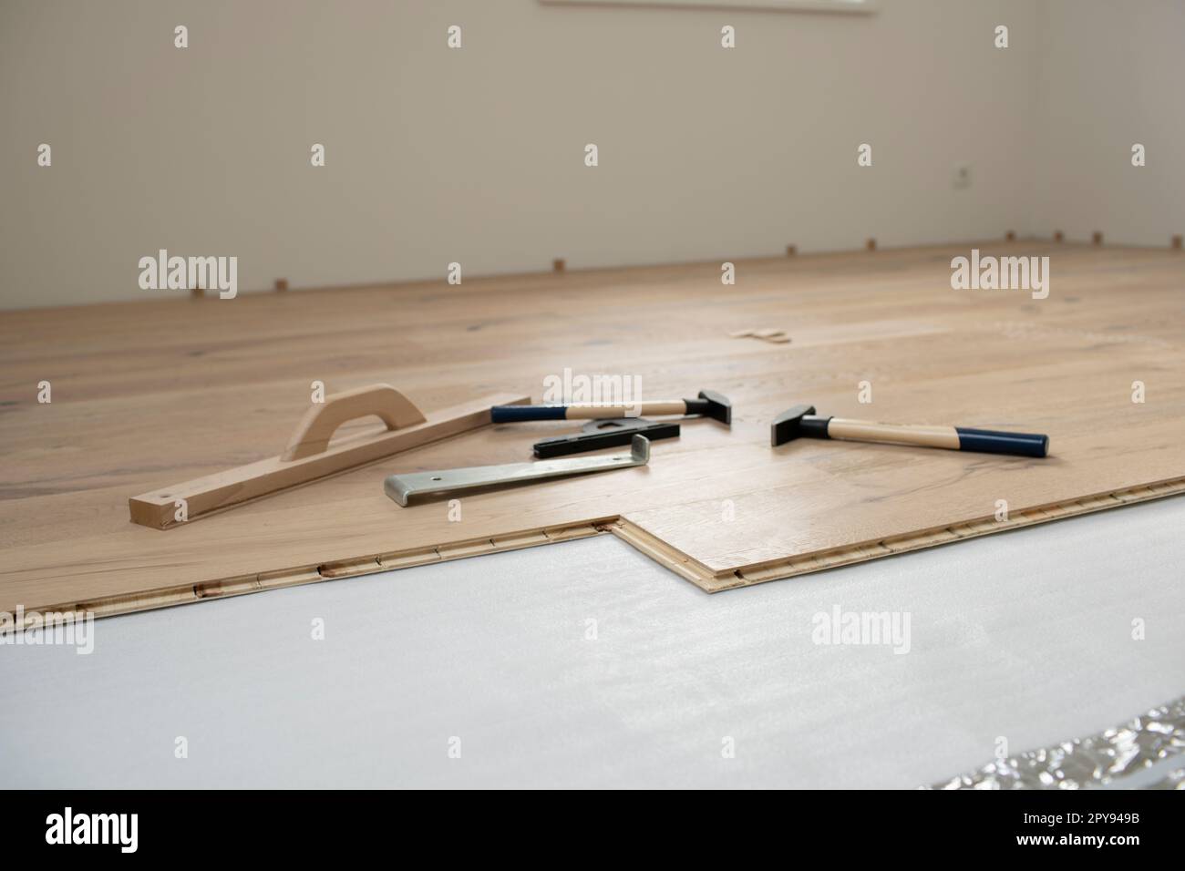 parquet floor laying in a new room, loft, new house Stock Photo - Alamy