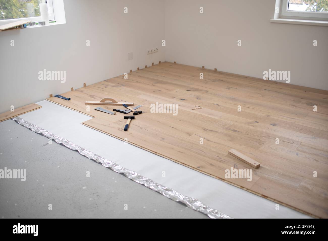 parquet floor laying in a new room, loft, new house Stock Photo - Alamy