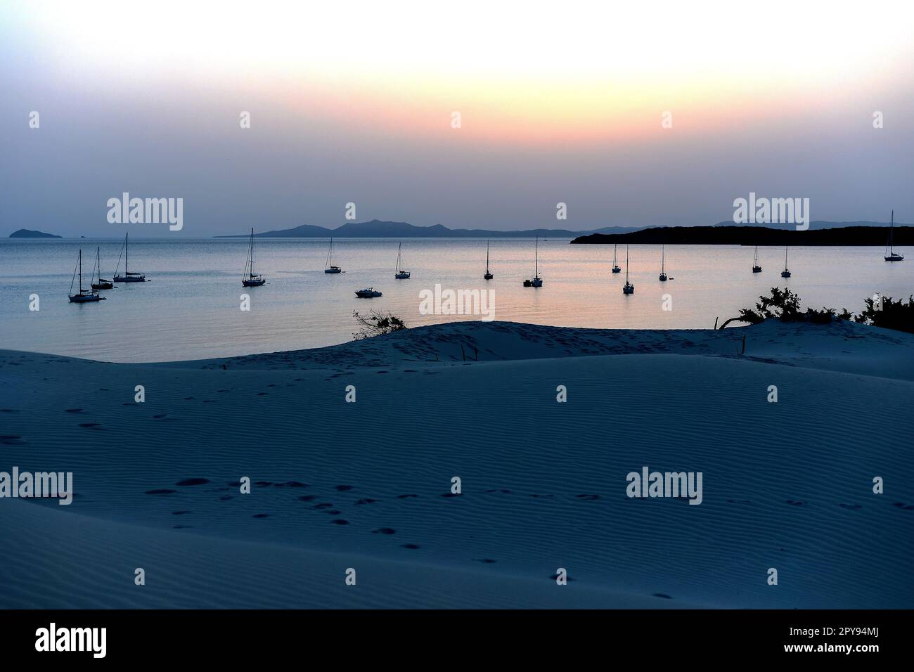 Sunset in Porto Pino beach, Sardinia Stock Photo - Alamy