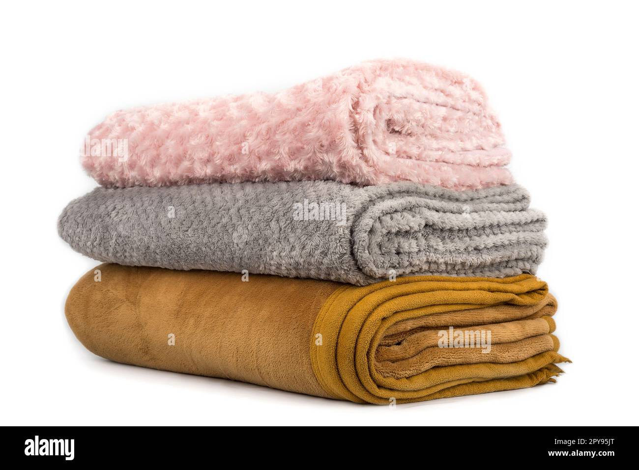 Folded blankets on a white background Stock Photo - Alamy