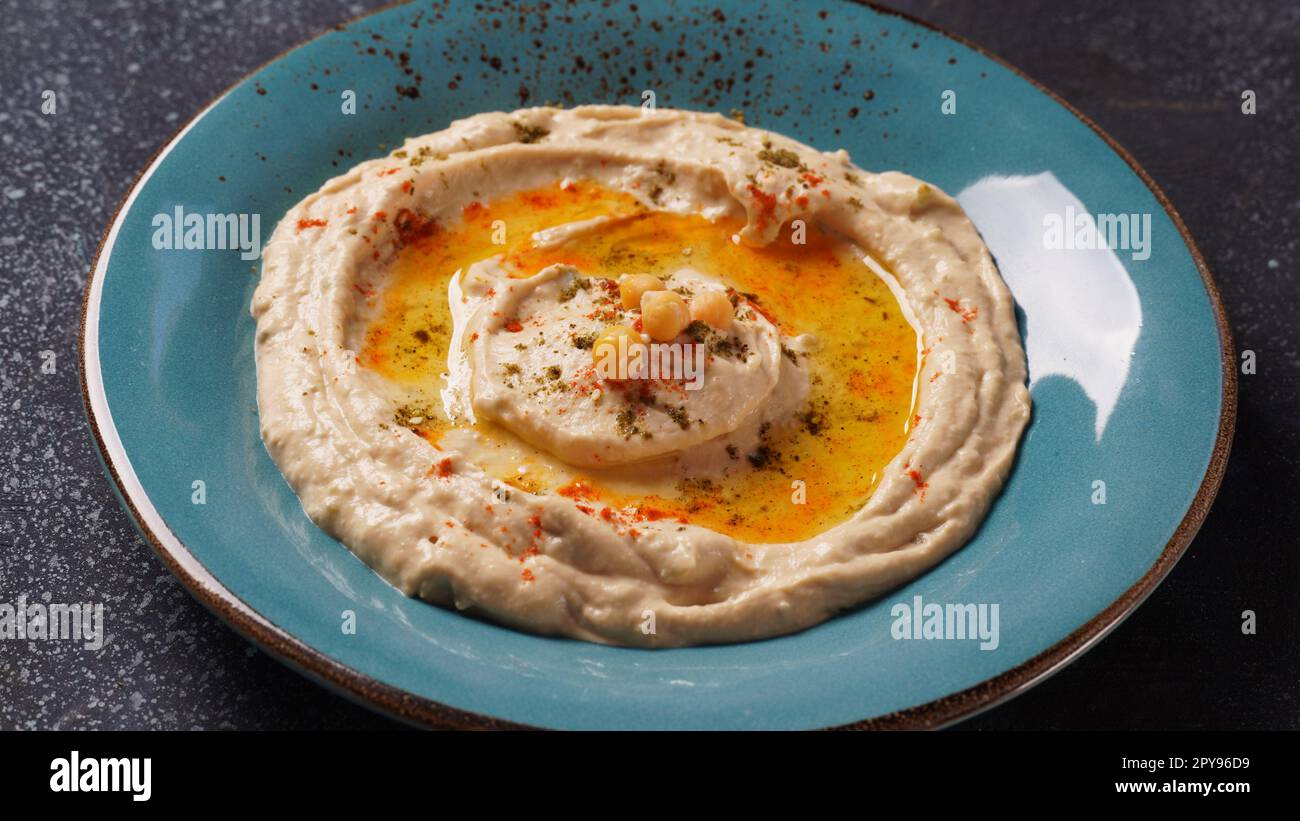 Hummus with olive oil, paprika, lemon and pita bread. Classic hummus on ...