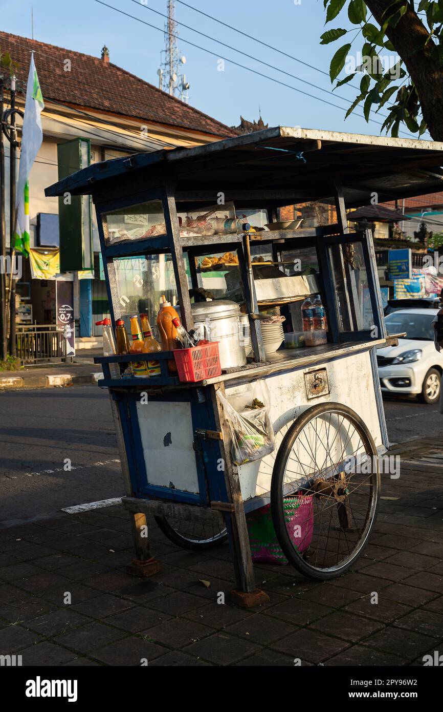 A streetfood cart on wheels in Bali, Indonesia selling food, vertical ...