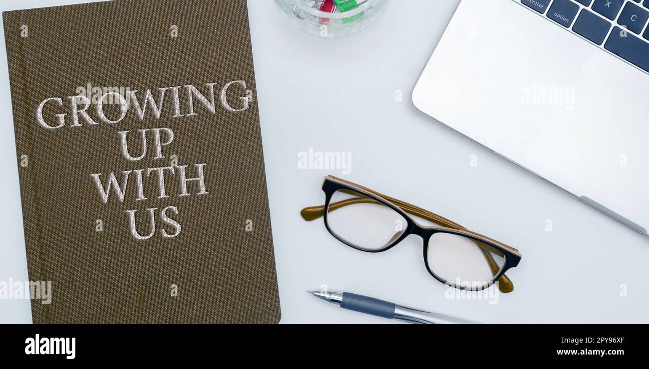 Hand writing sign Growing Up With Us. Business showcase offering help ...