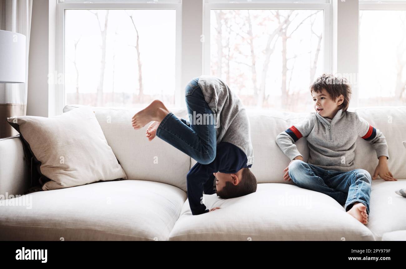 Childhood days were made for play. two adorable brothers playing ...