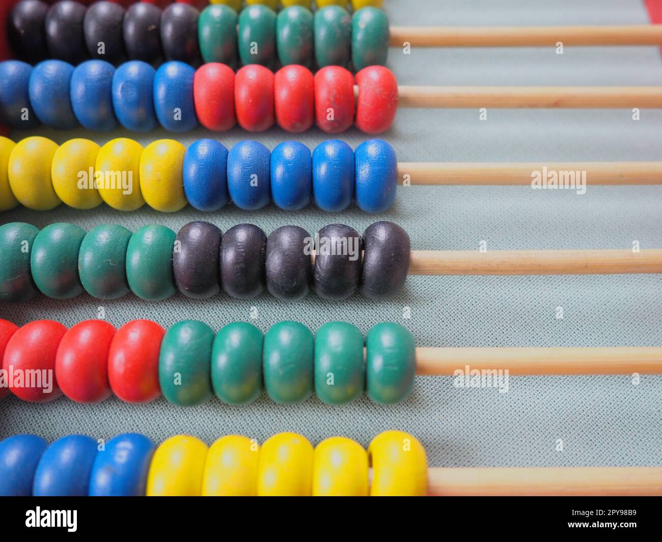 Education concept - abacus with many colorful beads. Red, blue, green ...
