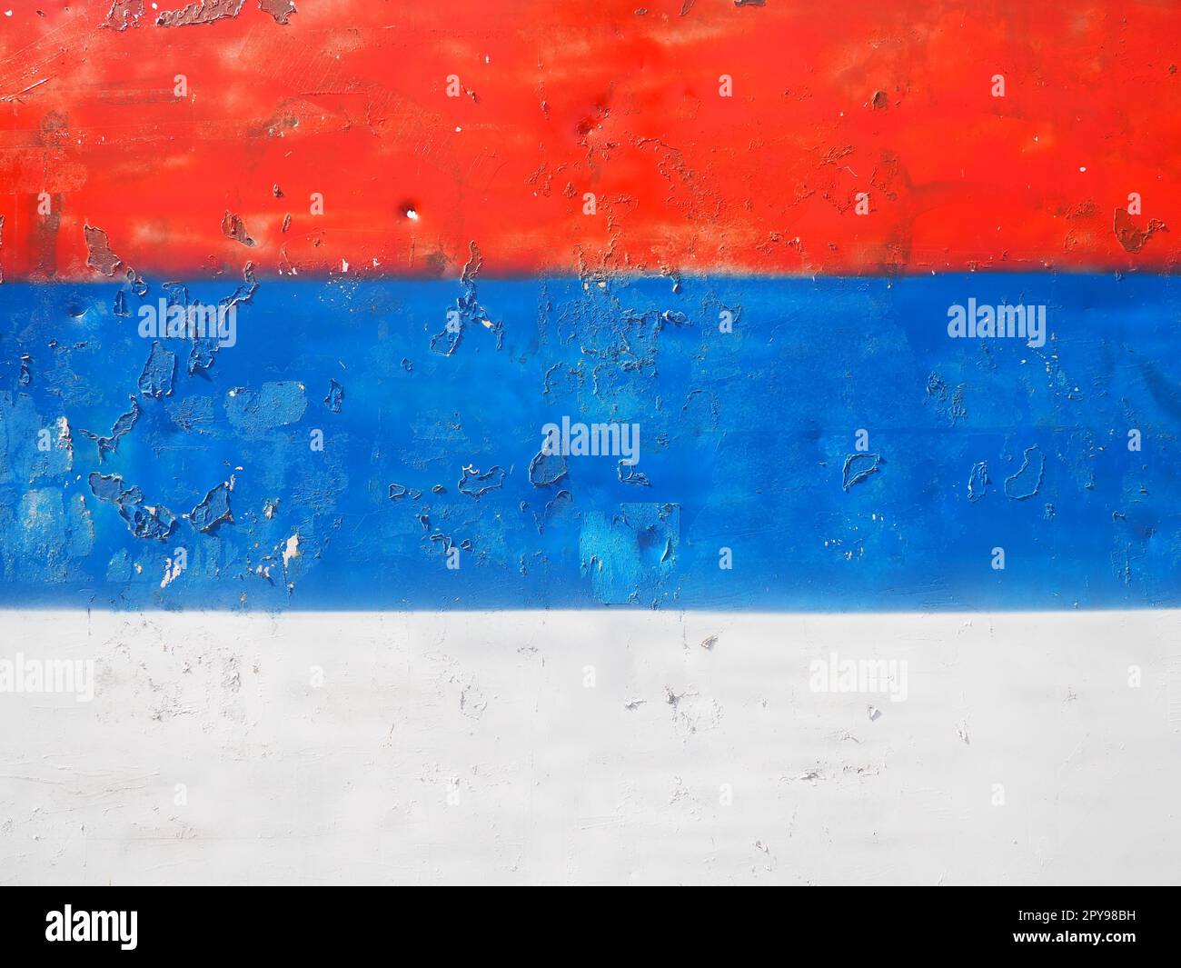 Serbian flag, tricolor red, blue, white painted on a metal surface ...