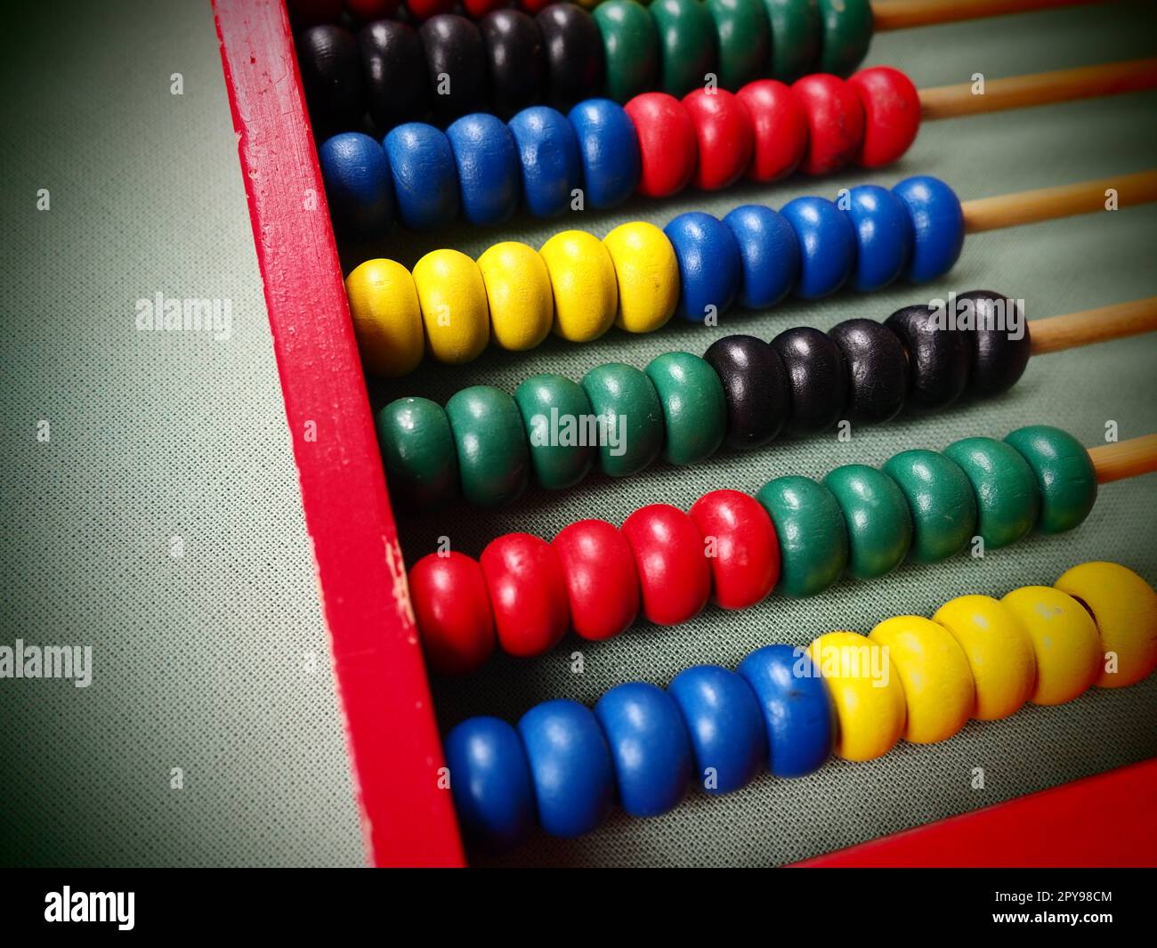 Education concept - abacus with many colorful beads. Red, blue, green ...