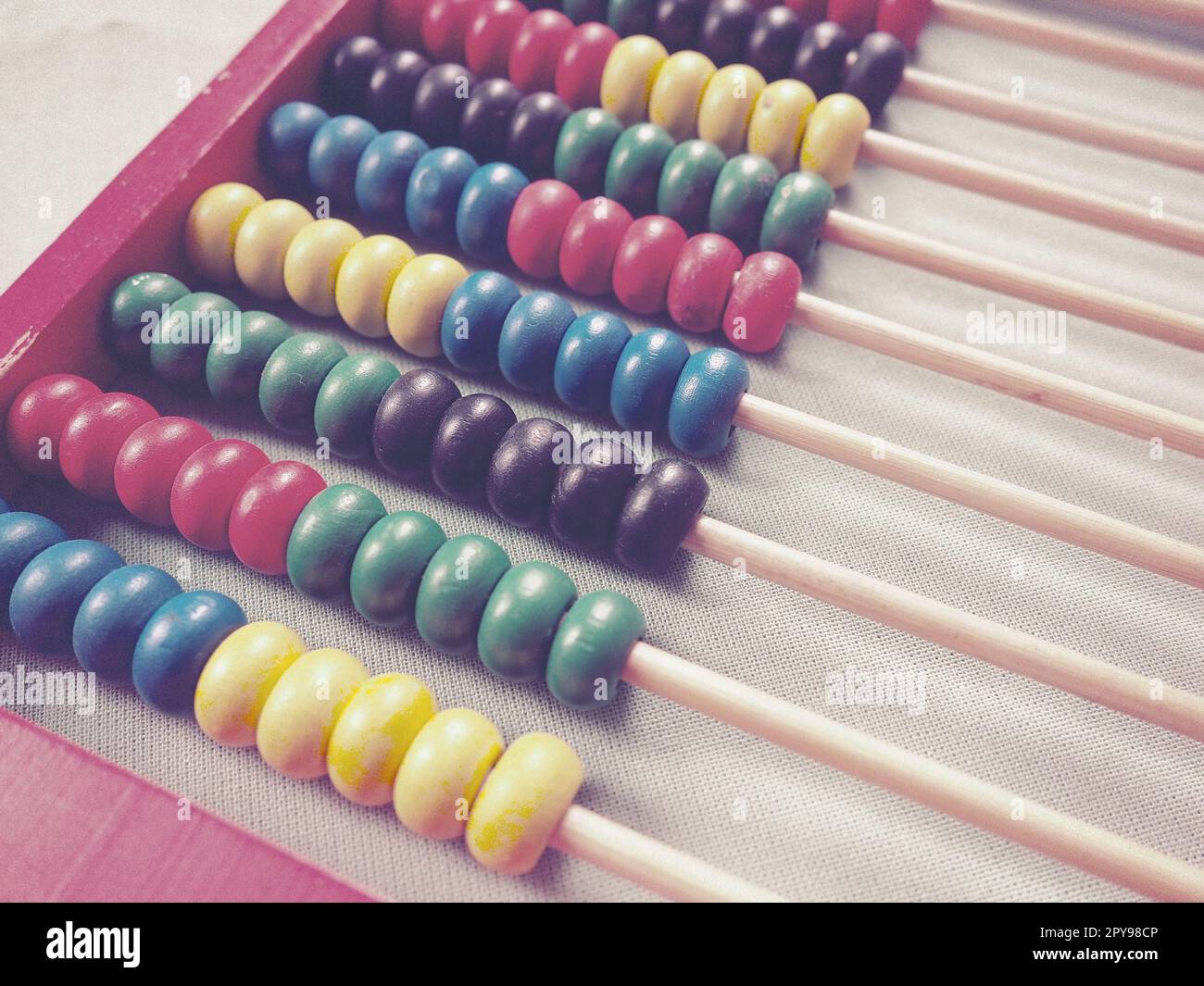 Education concept - abacus with many colorful beads. Red, blue, green ...