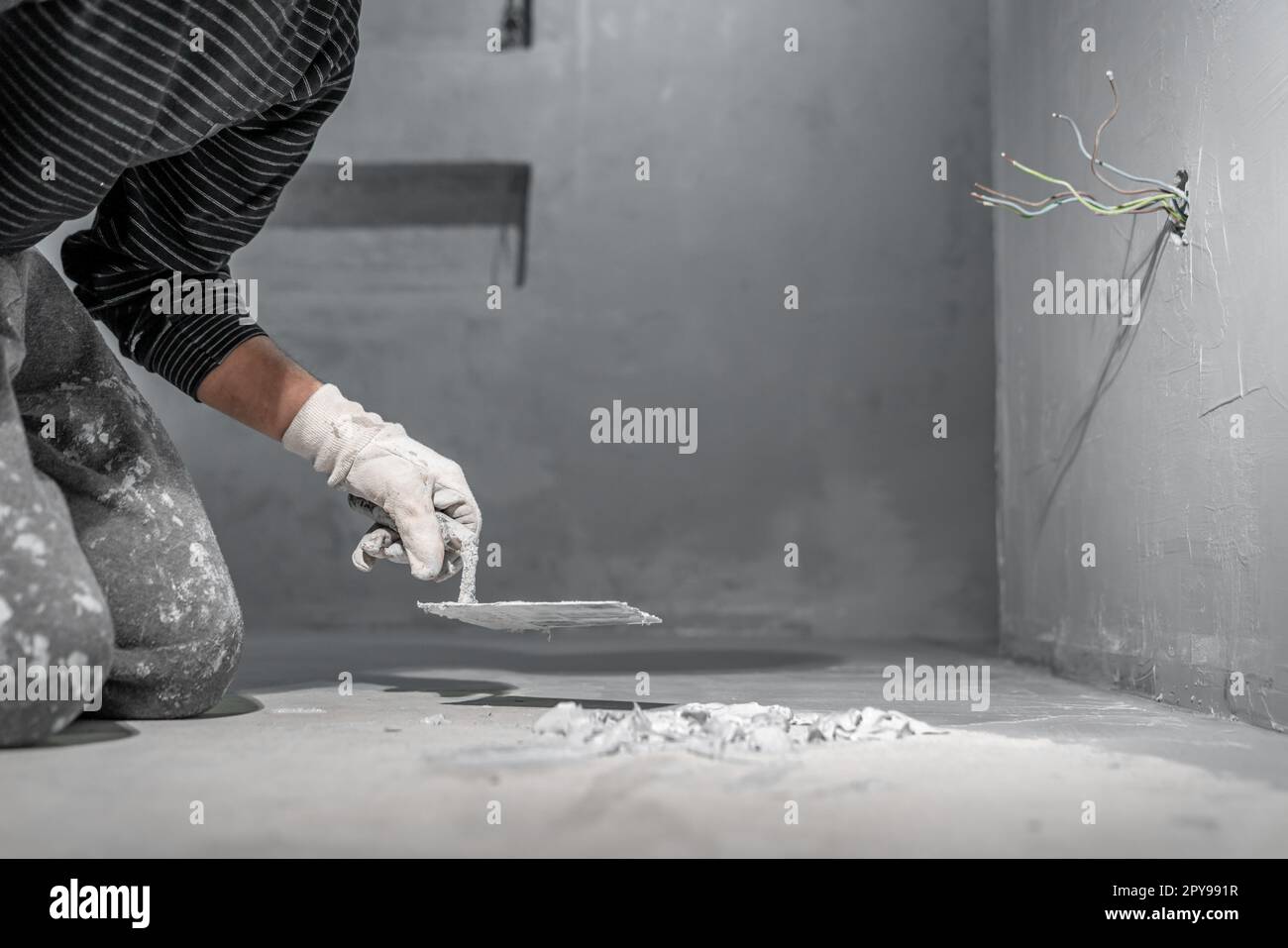 masonry work with a trowel on the construction site Stock Photo - Alamy