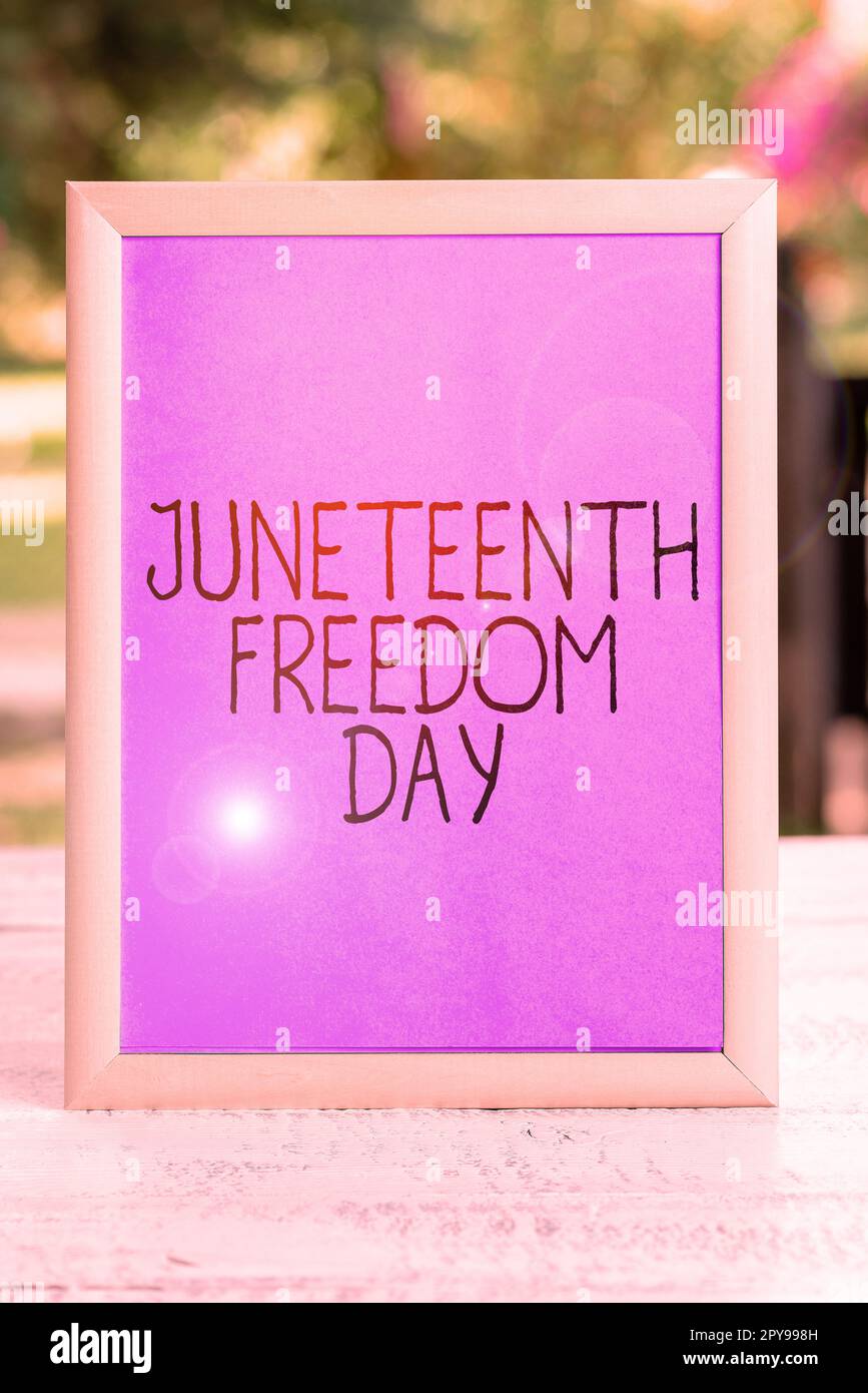 Sign displaying Juneteenth Freedom Day. Word for legal holiday in the ...