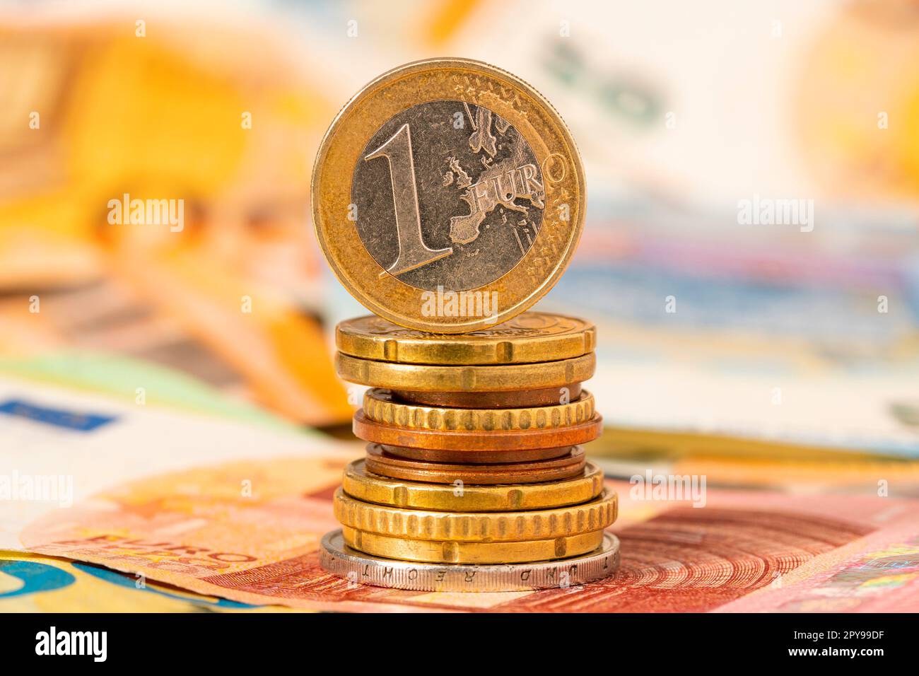 Euro coins stack and bills of euro banknotes Stock Photo - Alamy