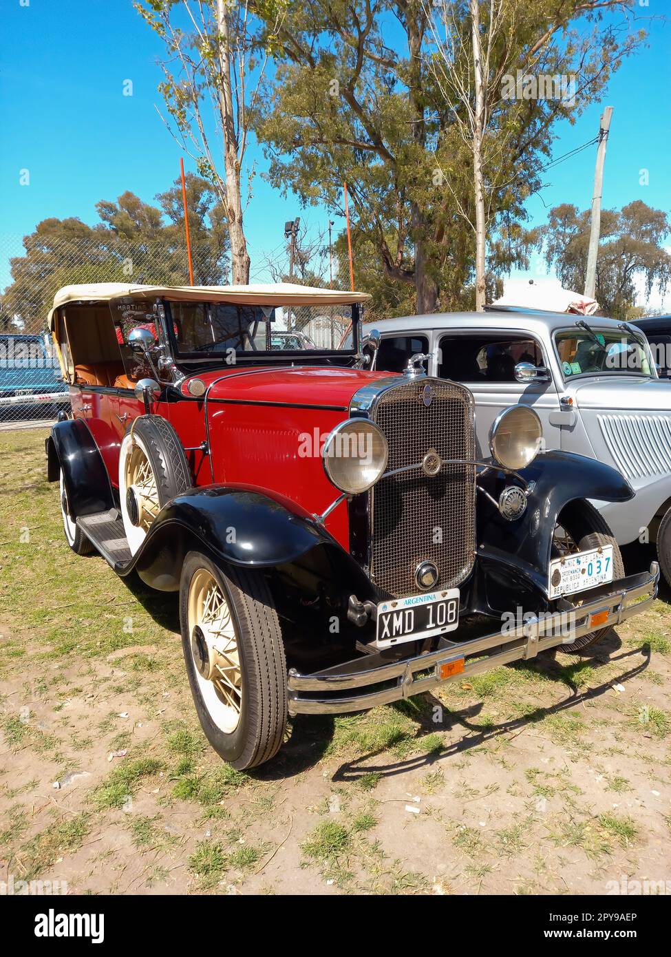 Old red 1931 Chevrolet Chevy Phaeton four door by General Motors in a ...