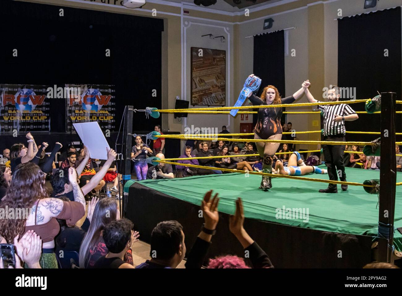 A female British wrestler celebrating her defense victory during ...