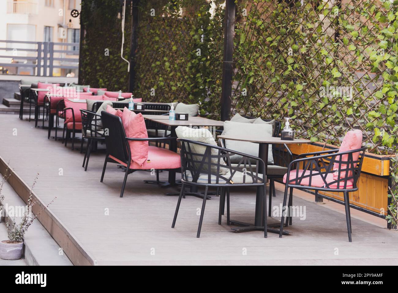 Empty cafe terrace with tables and chairs. Exterior of cafe restaurant ...