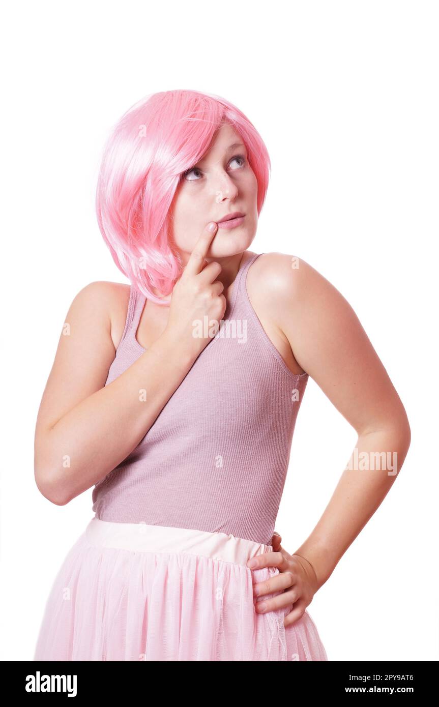cute girlish young woman dressed in pink thinking or considering an ...