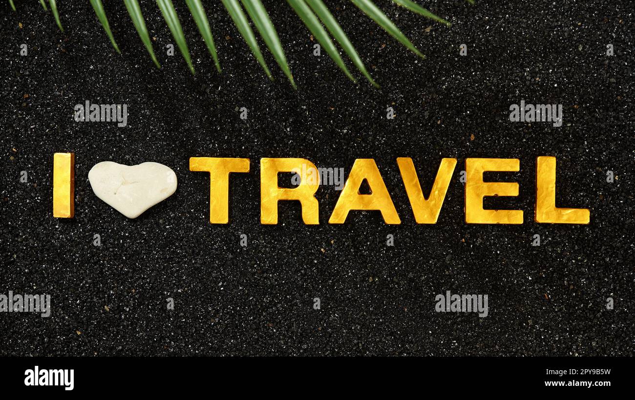 I Love Travel - Text in black beach sand Stock Photo - Alamy