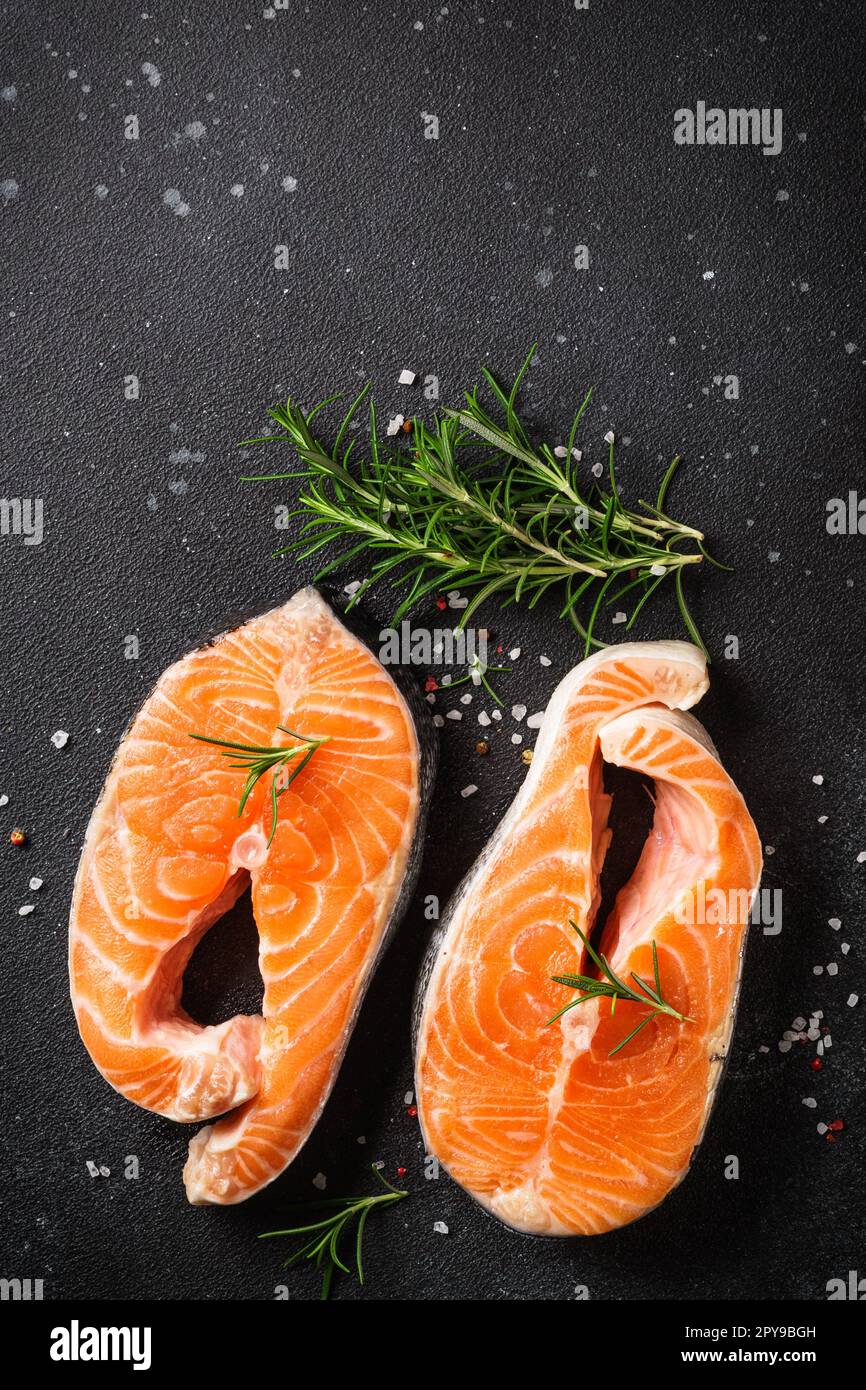 Salmon fish fresh salmon steak on black table Stock Photo - Alamy