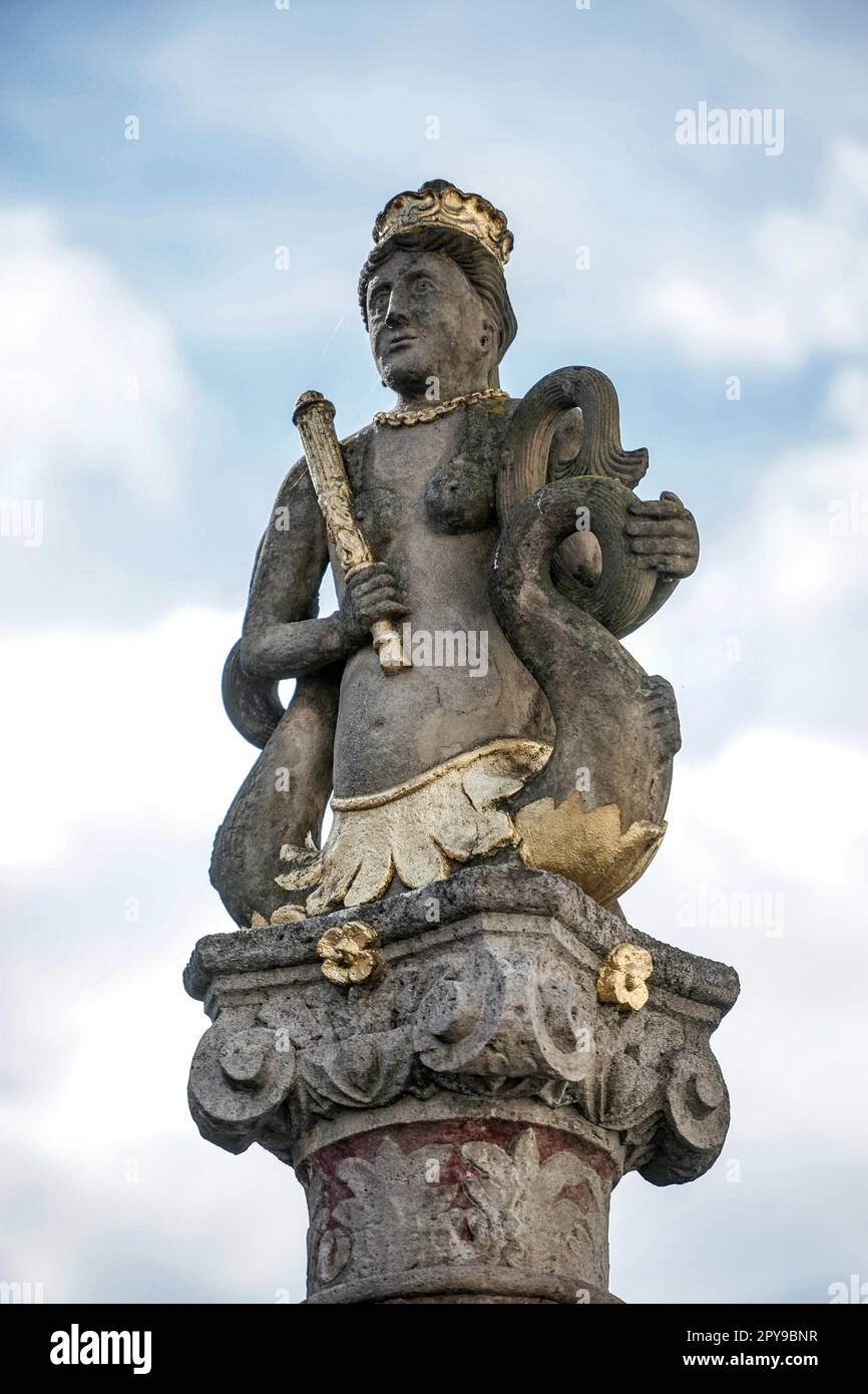 Mermaid statue on top of a column in Rothenburg Stock Photo - Alamy