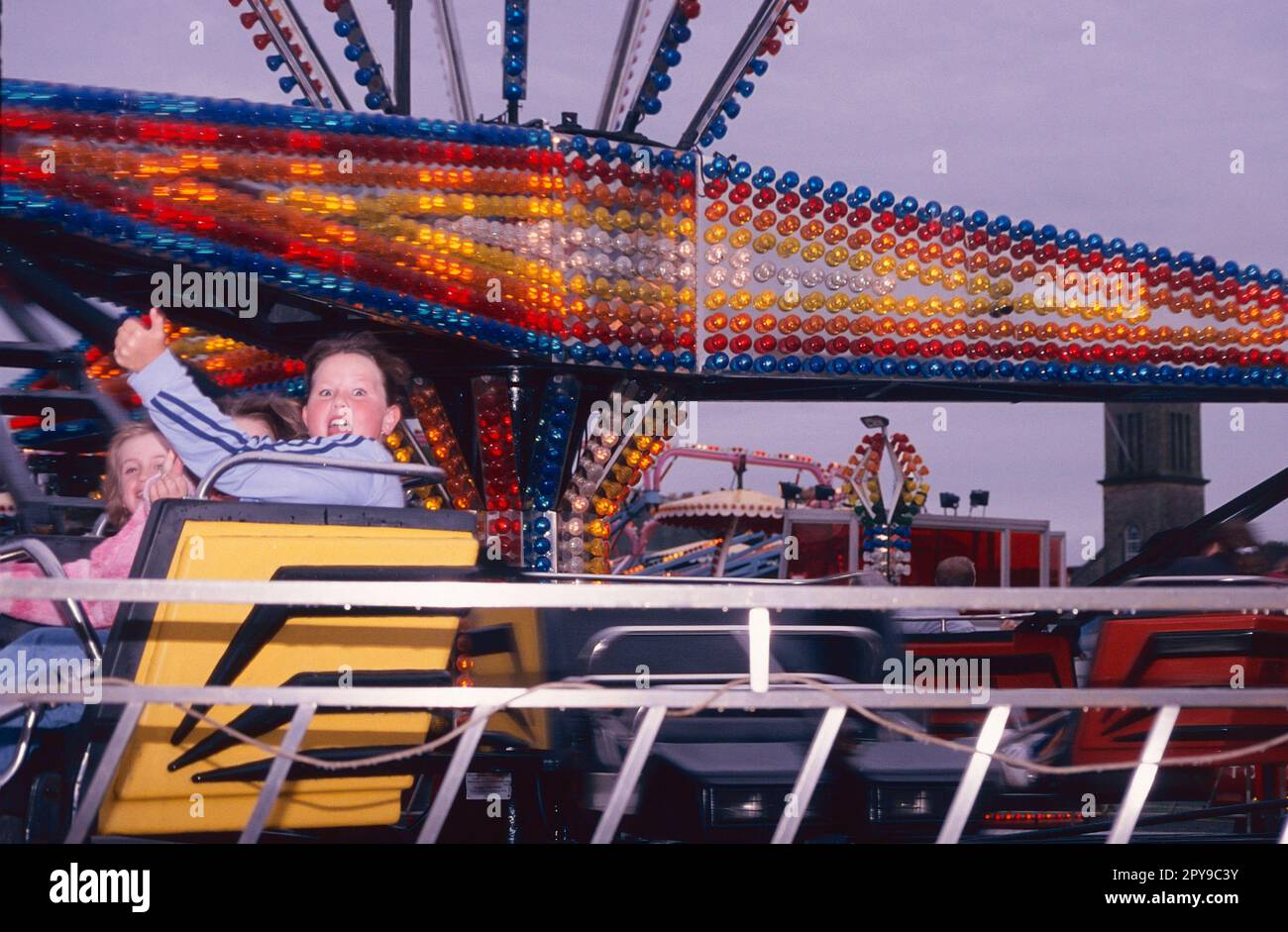 Girls on funfair ride on hi-res stock photography and images - Alamy