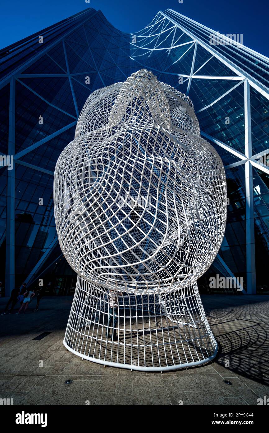 The 'Wonderland' sculpture in front of the Bow Tower, in downtown ...