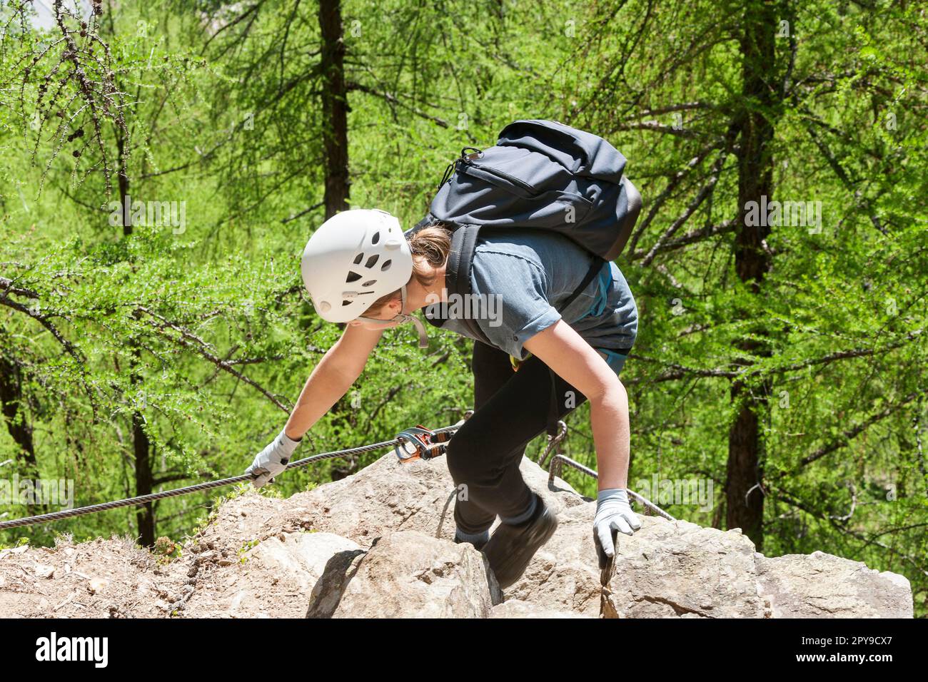 Woman climbing rock waterfall hi-res stock photography and images - Alamy