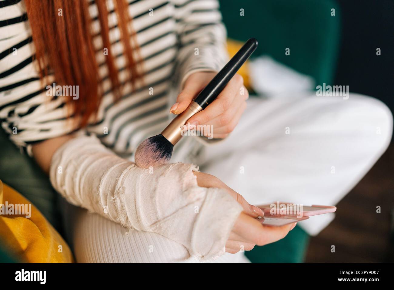 Closeup high-angle view of unrecognizable injured young woman with ...