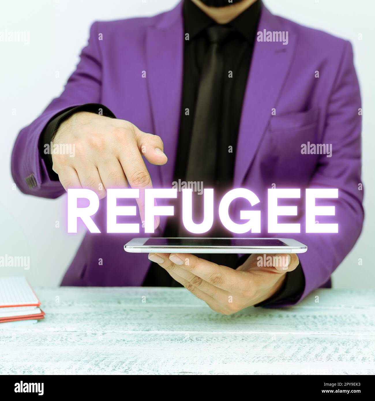 Hand writing sign Refugee. Internet Concept refer to movements of large ...