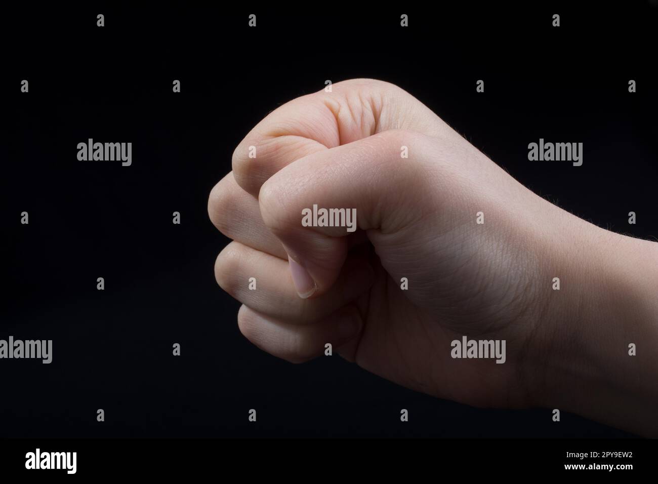 Hand closed for a fist gesture in black Stock Photo - Alamy