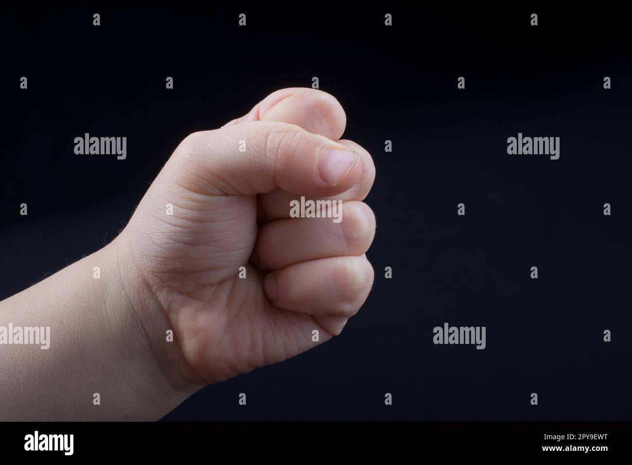 Hand closed for a fist gesture in black Stock Photo - Alamy