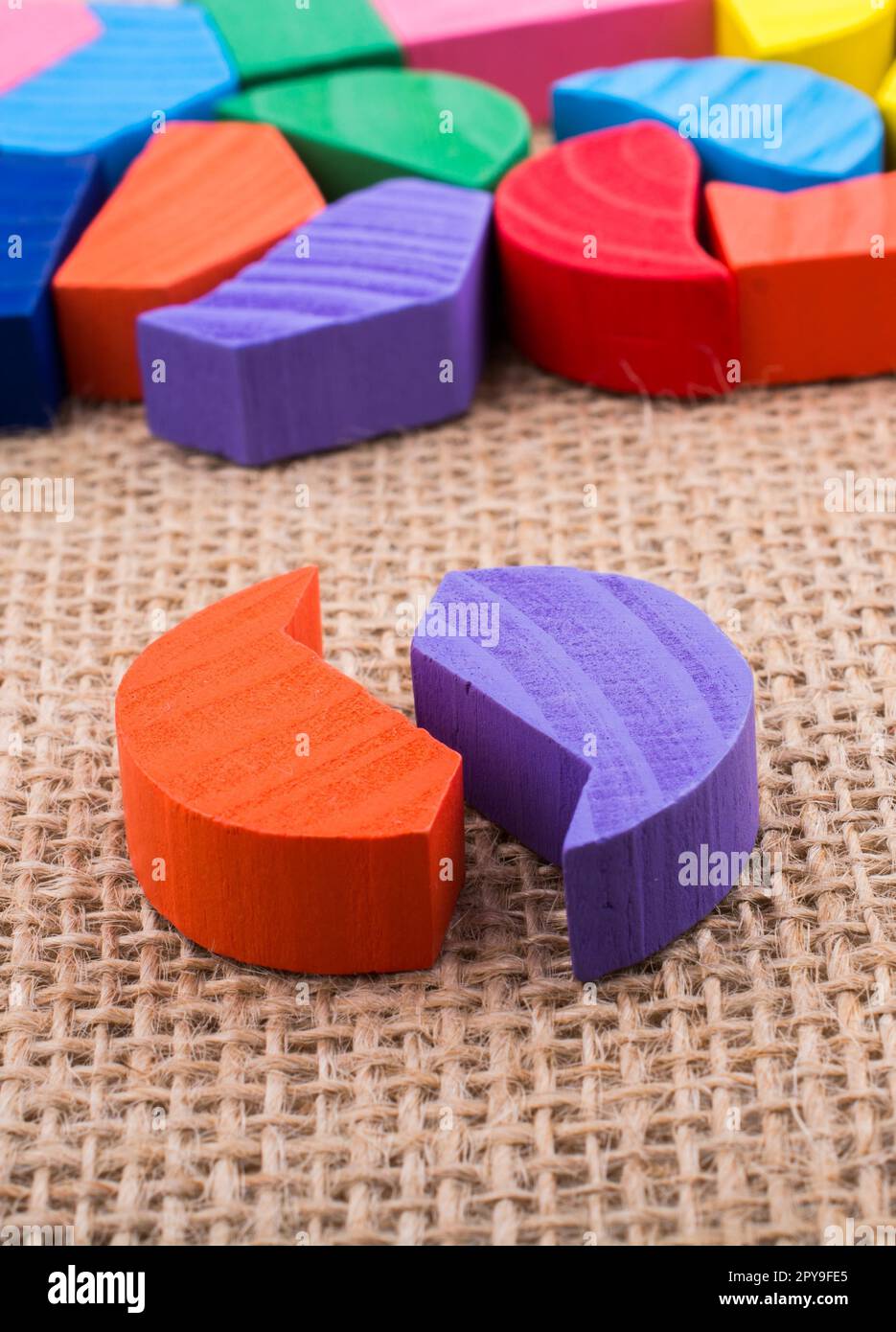Colorful wooden pieces of a logic puzzle Stock Photo - Alamy