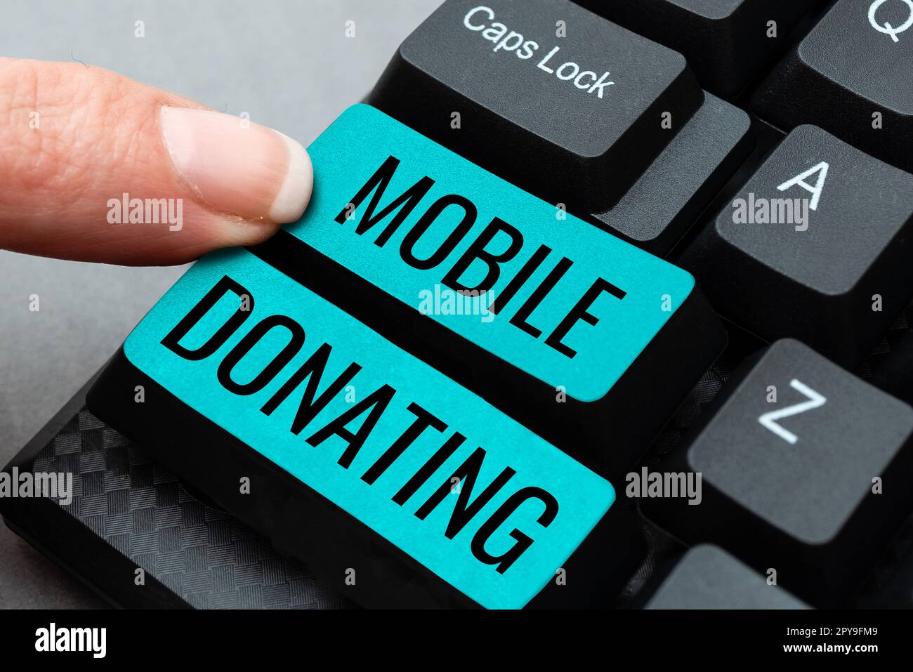 Hand writing sign Mobile Donating. Concept meaning to give something to ...