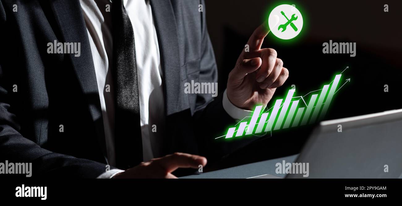 Businessman in office suit sitting at the table ant typing important ...