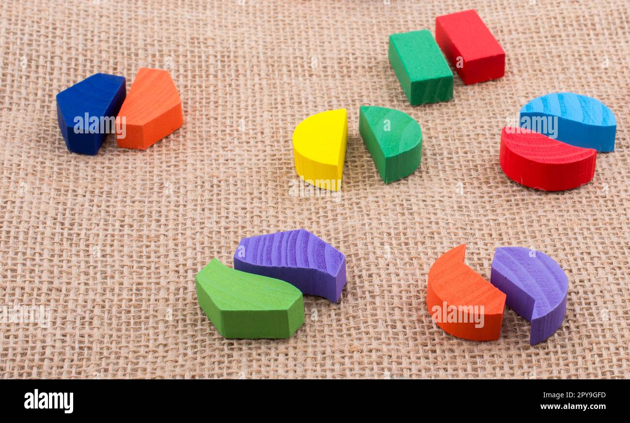 Colorful wooden pieces of a logic puzzle Stock Photo - Alamy