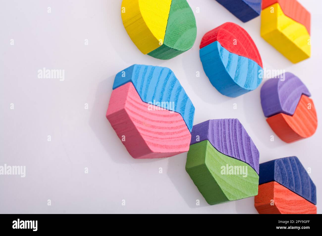 Colorful wooden pieces of a logic puzzle Stock Photo - Alamy