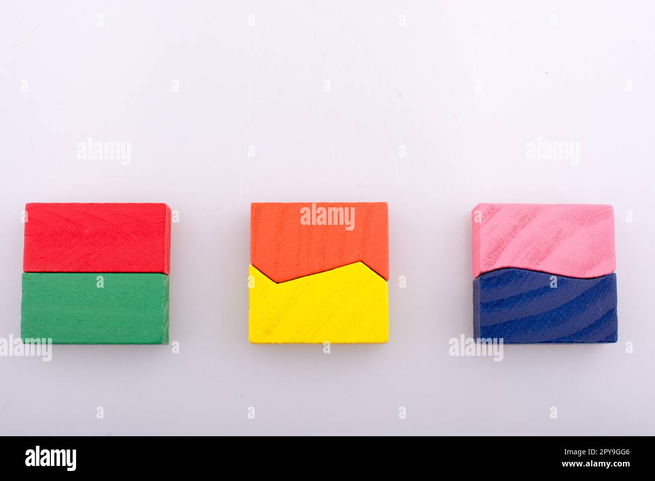 Colorful wooden pieces of a logic puzzle Stock Photo - Alamy
