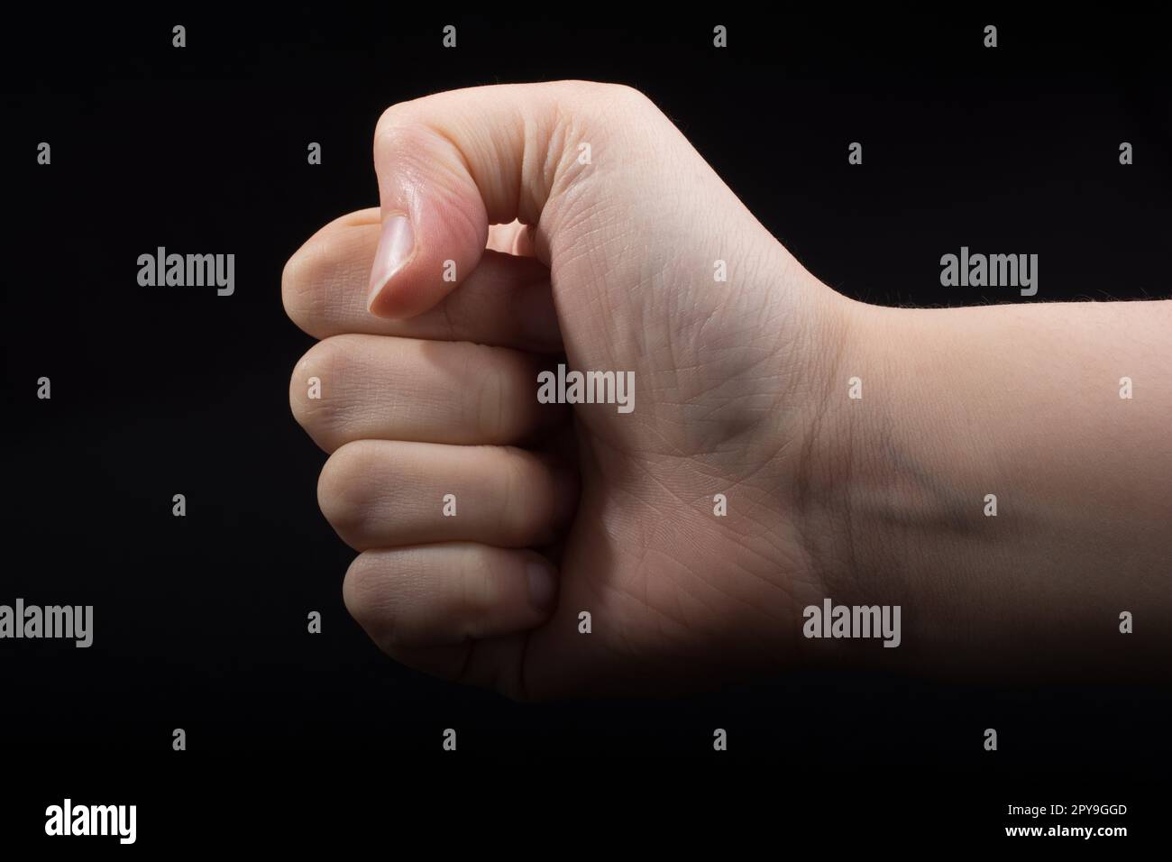 Hand closed for a fist gesture in black Stock Photo - Alamy