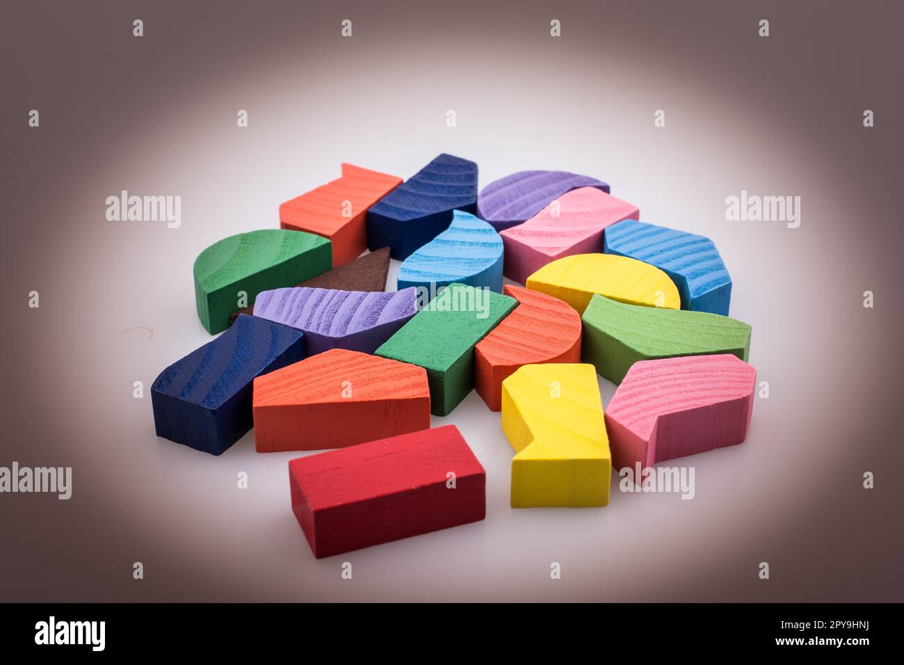 Colorful wooden pieces of a logic puzzle Stock Photo - Alamy