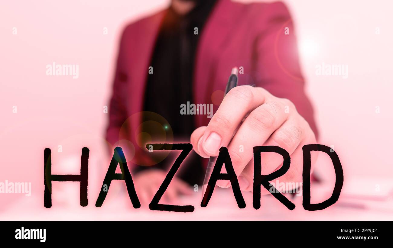 Hand writing sign Hazard. Word Written on account or statement ...