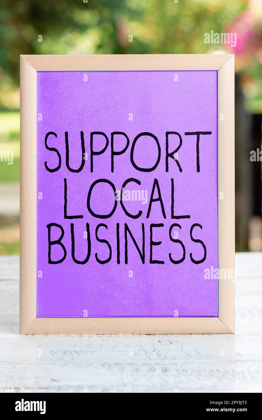 Hand writing sign Support Local Business. Business concept increase ...