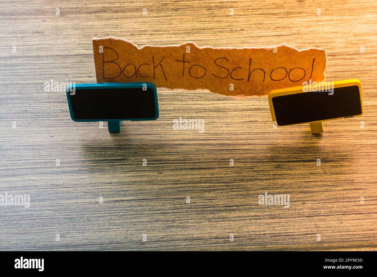 Back to school wording on a piece of torn paper Stock Photo - Alamy